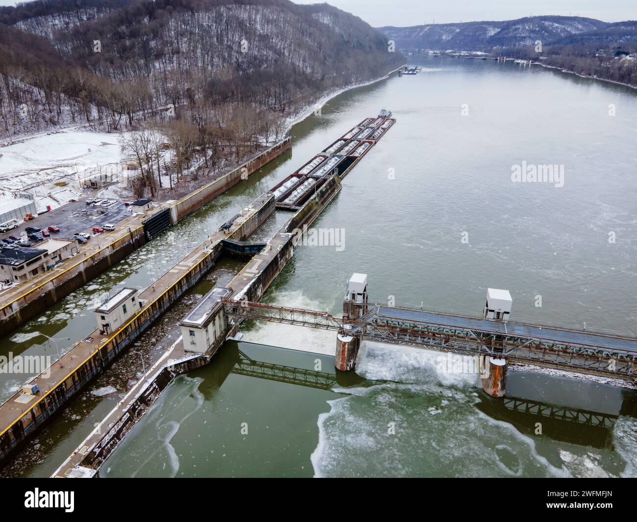 A towboat pushes 15 barges, most filled with coal, on the Ohio River ...