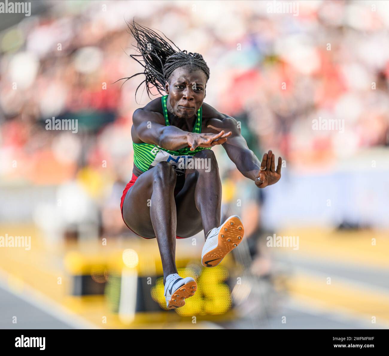 Marthe KOALA participating in the long jump at the World Athletics ...