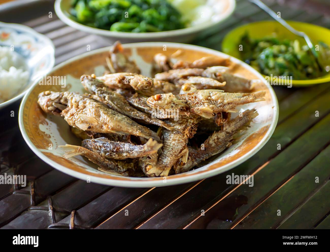 Fried fish with rice and vegetables on, ndonesian cuisine, Indonesian ...