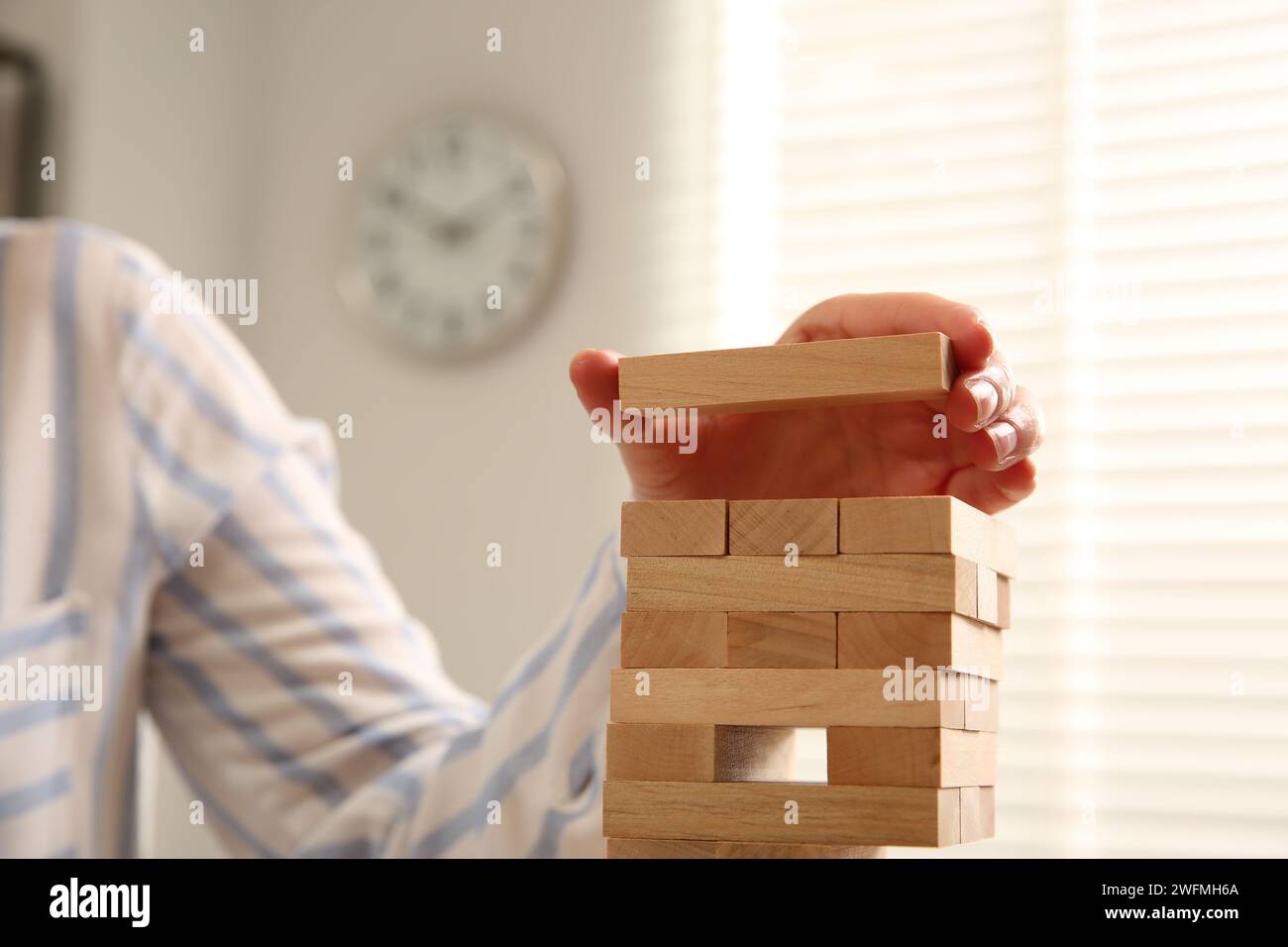 Woman building tower hi-res stock photography and images - Alamy
