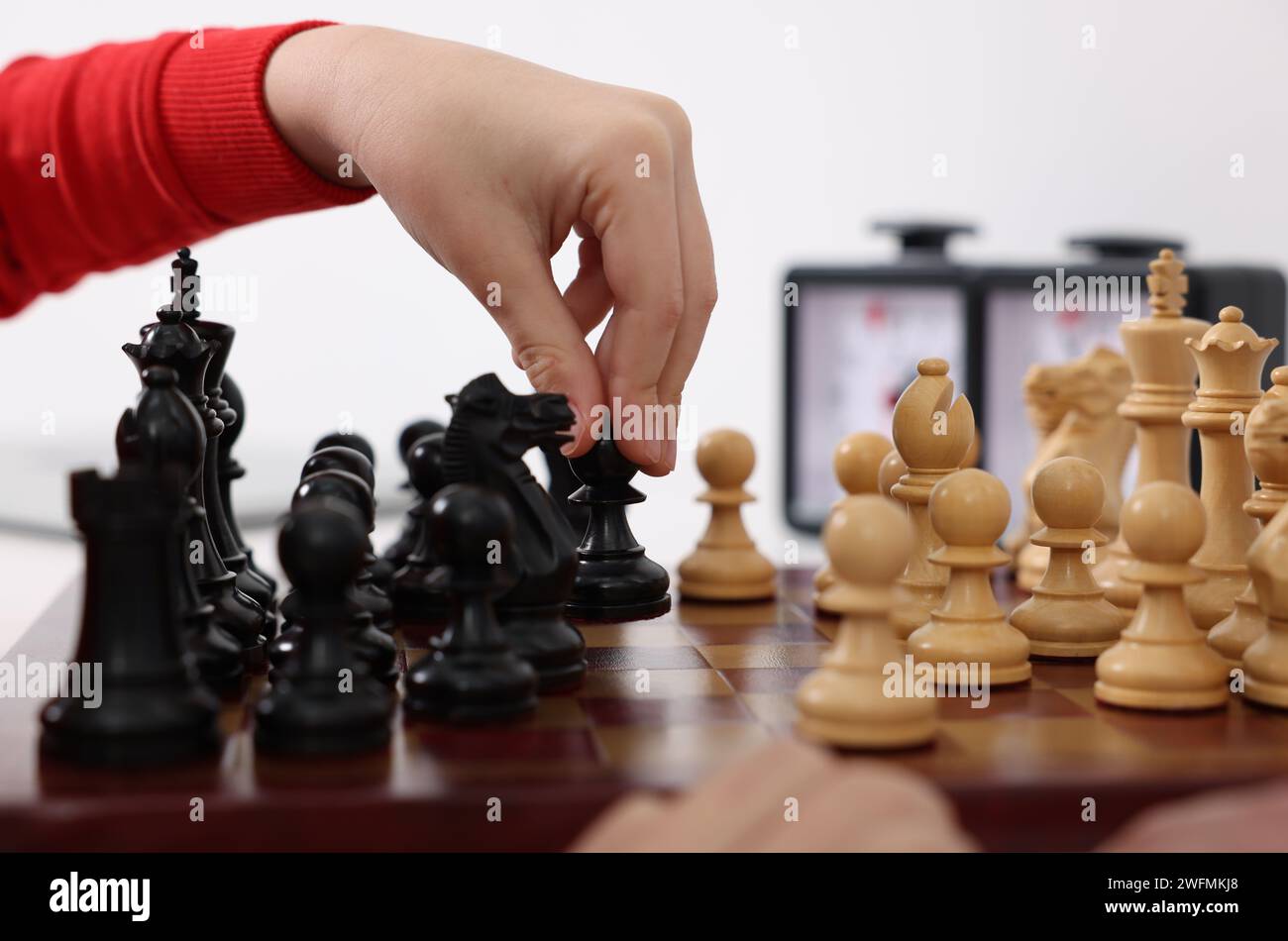Little child playing chess at table indoors, closeup Stock Photo - Alamy