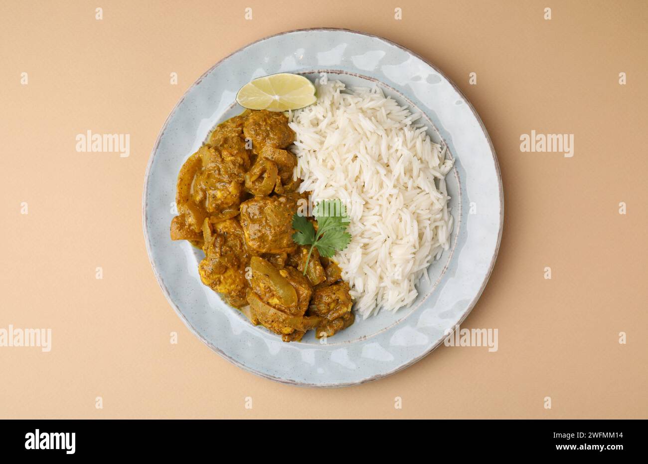 Delicious chicken curry with rice on beige background, top view Stock ...