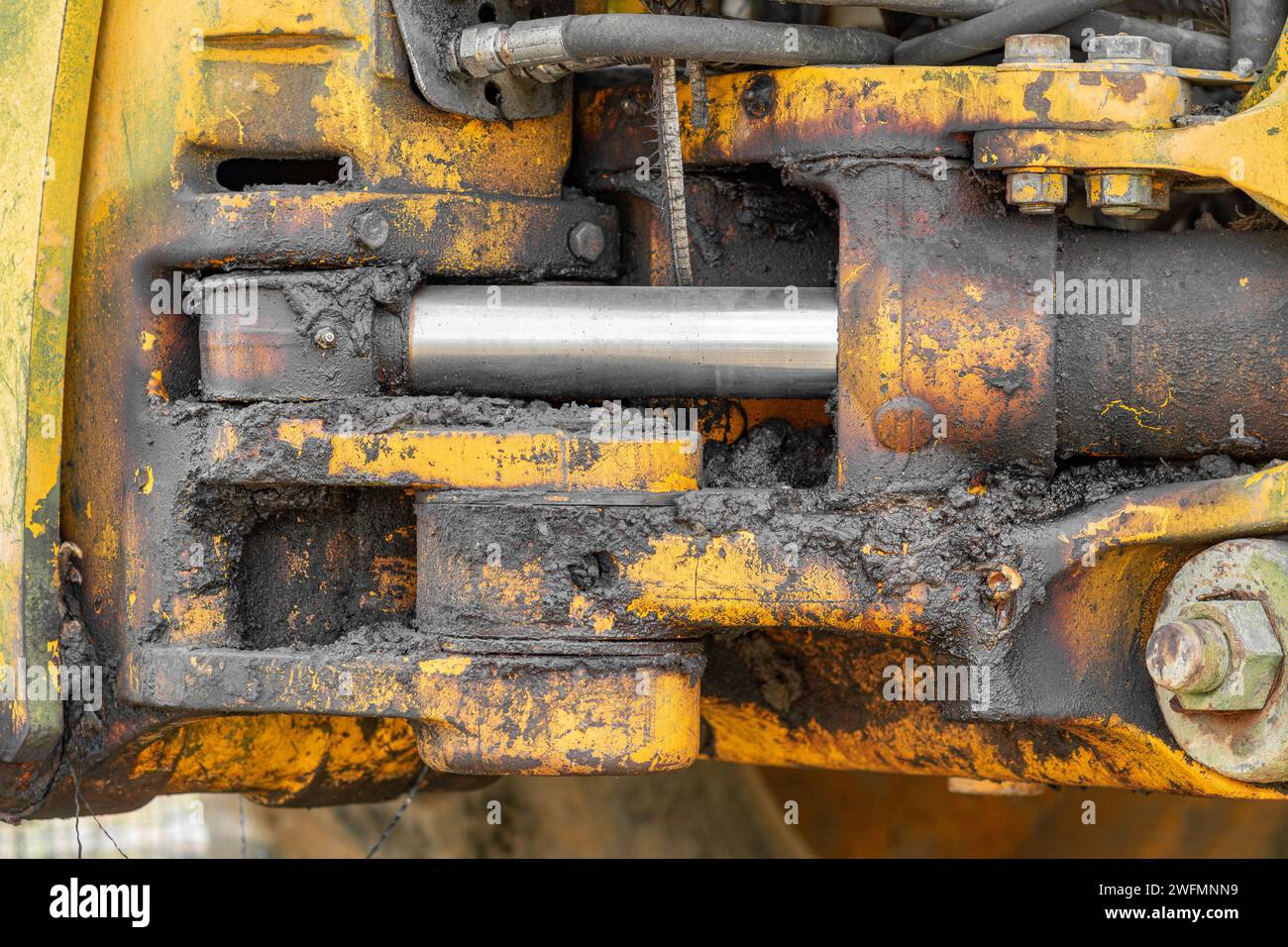 Close up photograph of an old and dirty part of heavy equipment ...