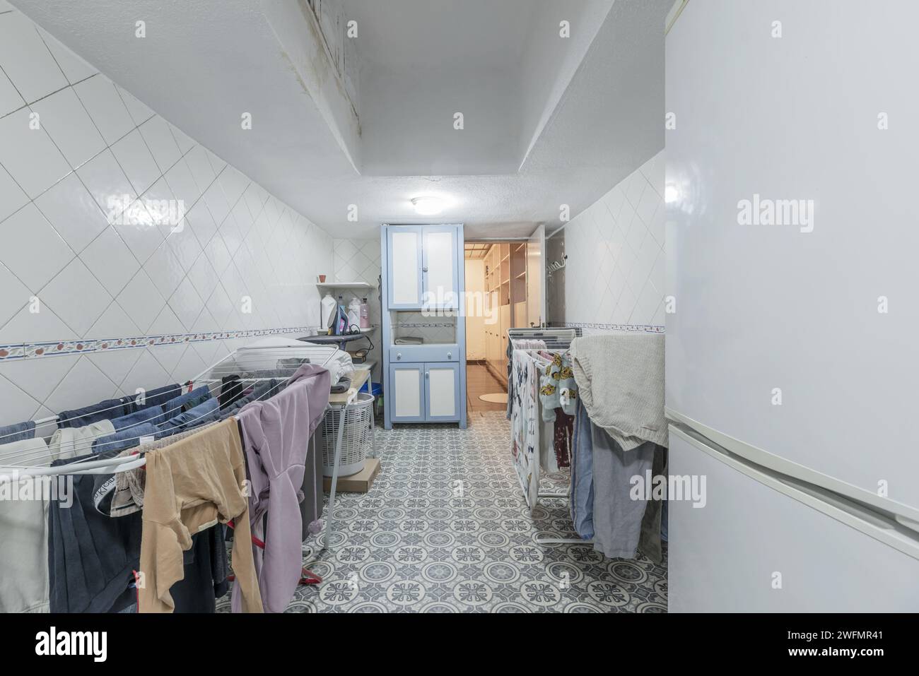 A room dedicated to laundry on the ground floor of a house full of ...