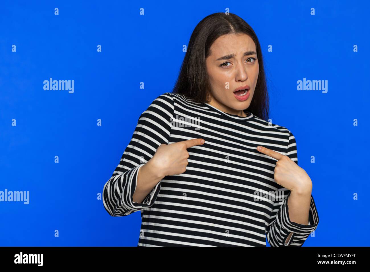 I am not guilty. Caucasian young woman pointing fingers herself ask say ...