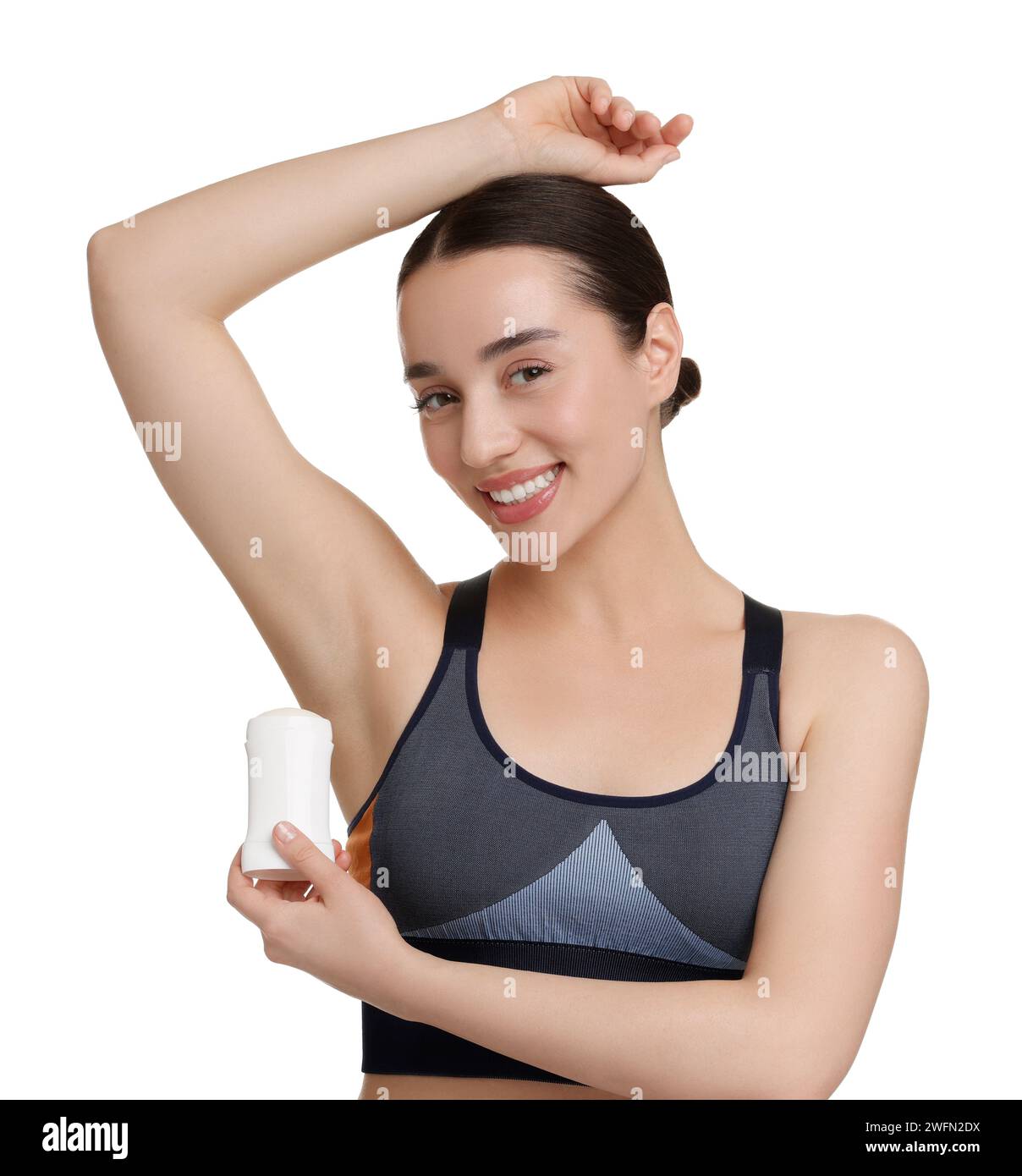 Beautiful woman applying deodorant on white background Stock Photo - Alamy