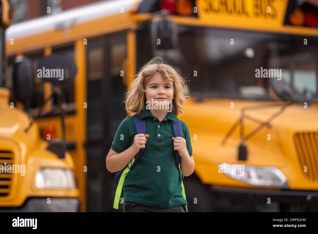 Schoolkid getting on the school bus. American School. Back to school ...
