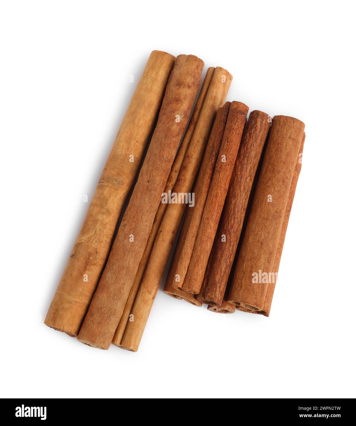 Dry aromatic cinnamon sticks isolated on white, top view Stock Photo ...