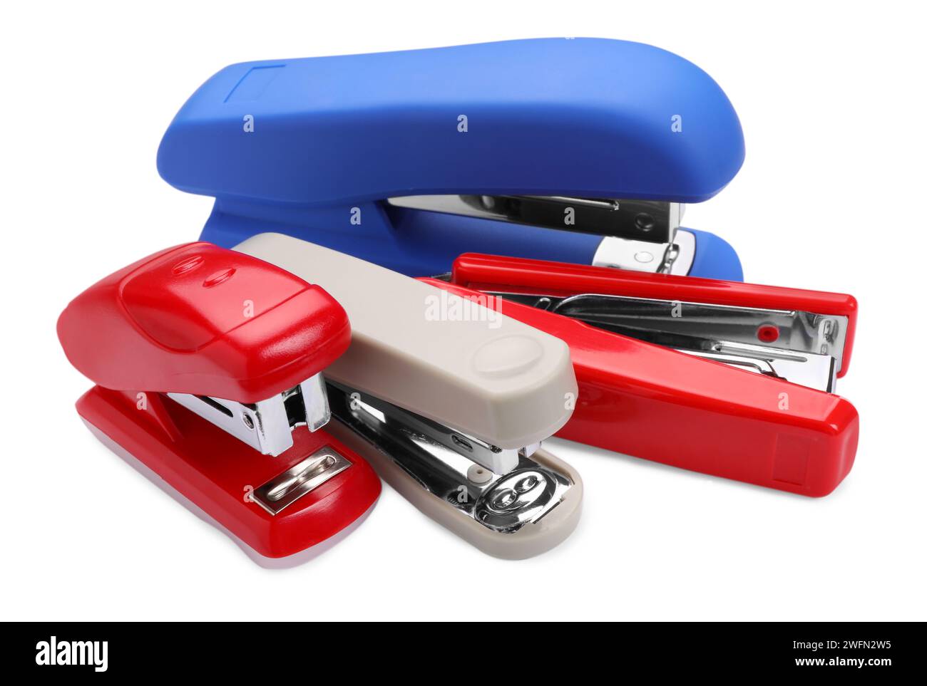 Many new bright staplers isolated on white Stock Photo - Alamy