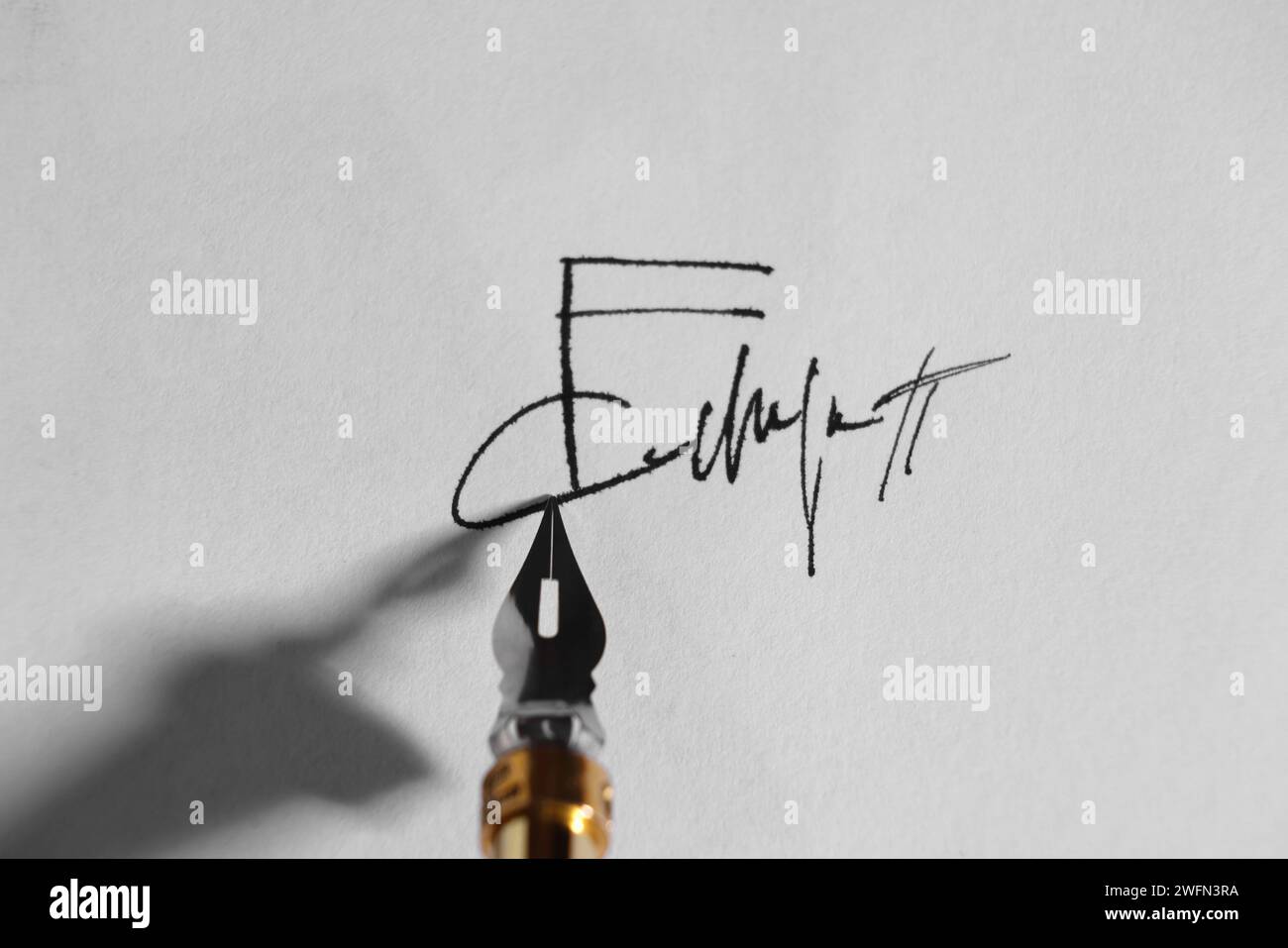 Signing on sheet of paper with fountain pen, closeup Stock Photo - Alamy
