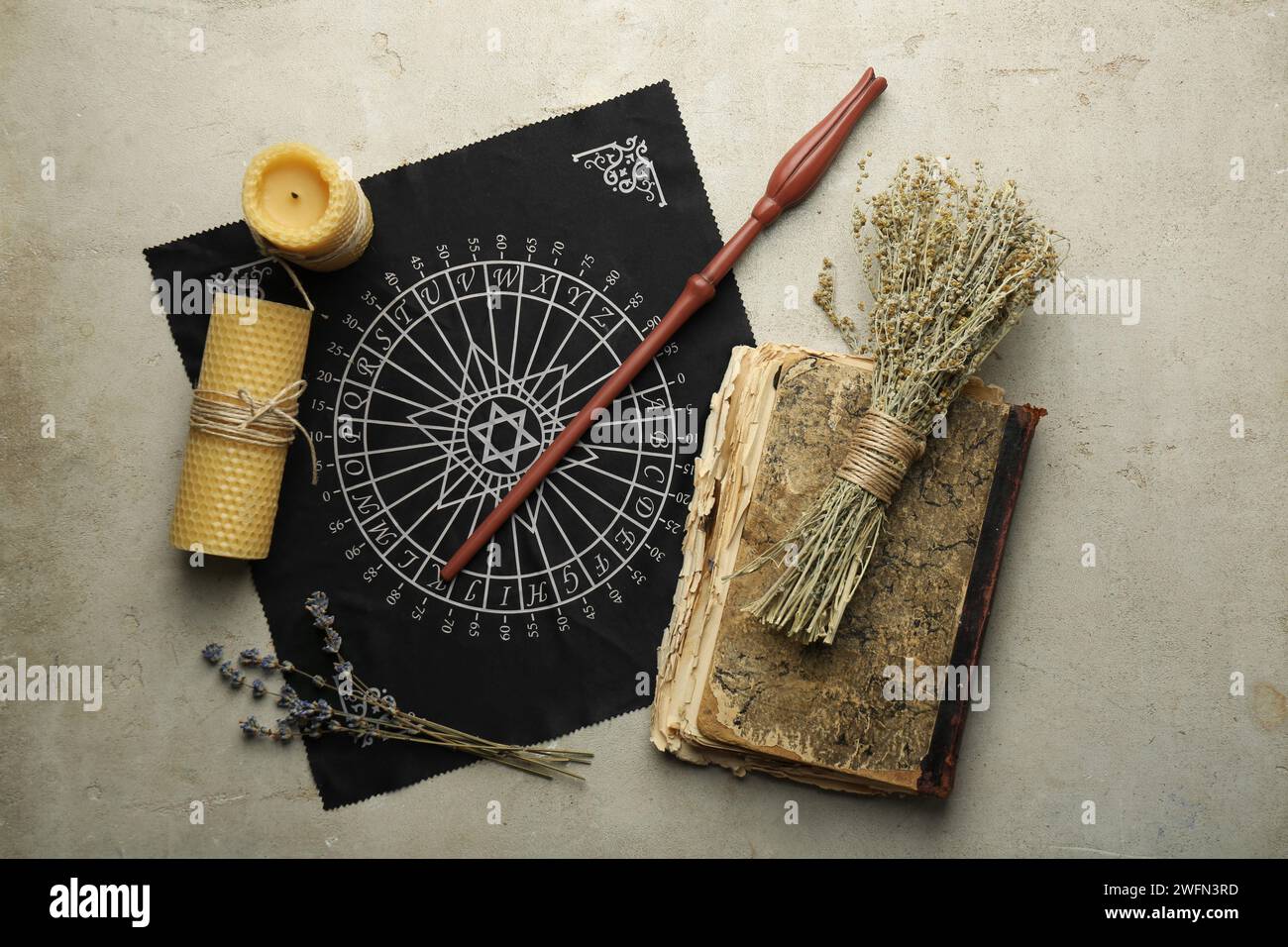 Flat lay composition with magic wand and divination cloth on light ...