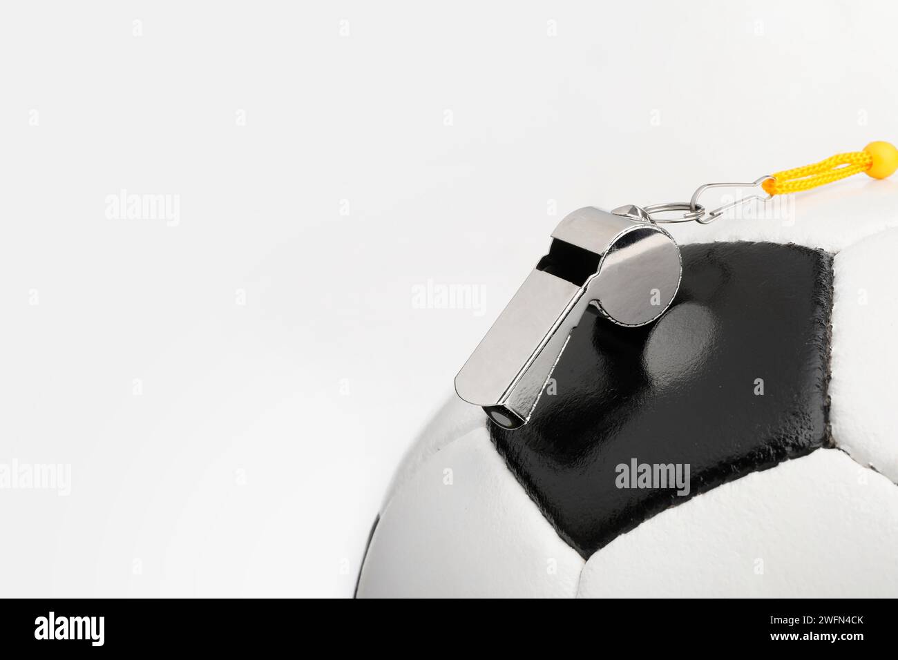 Football referee equipment. Soccer ball and whistle on white background ...