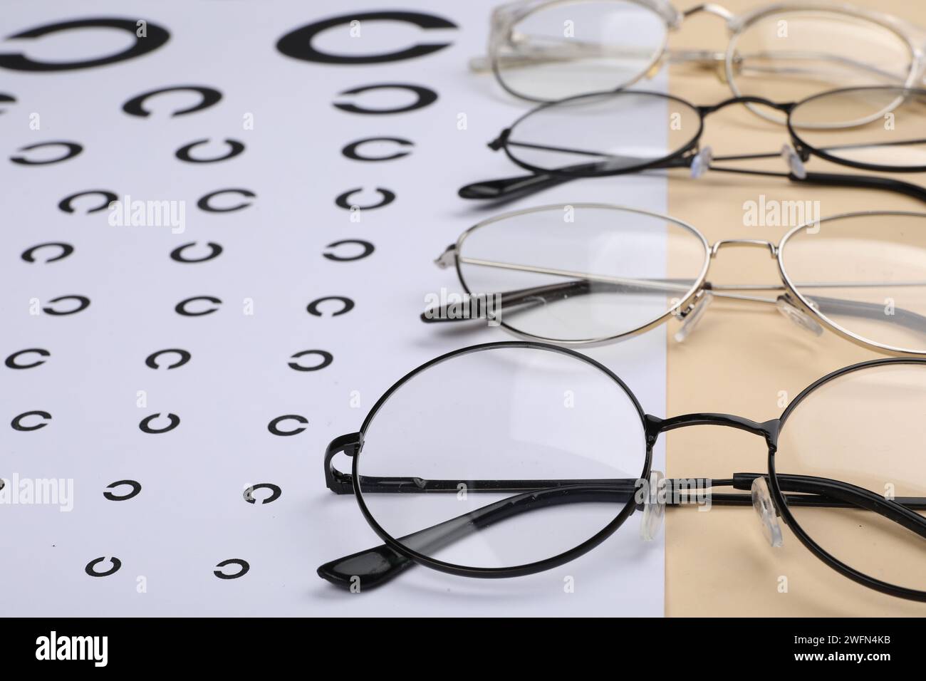 Vision test chart and glasses on table, closeup Stock Photo - Alamy