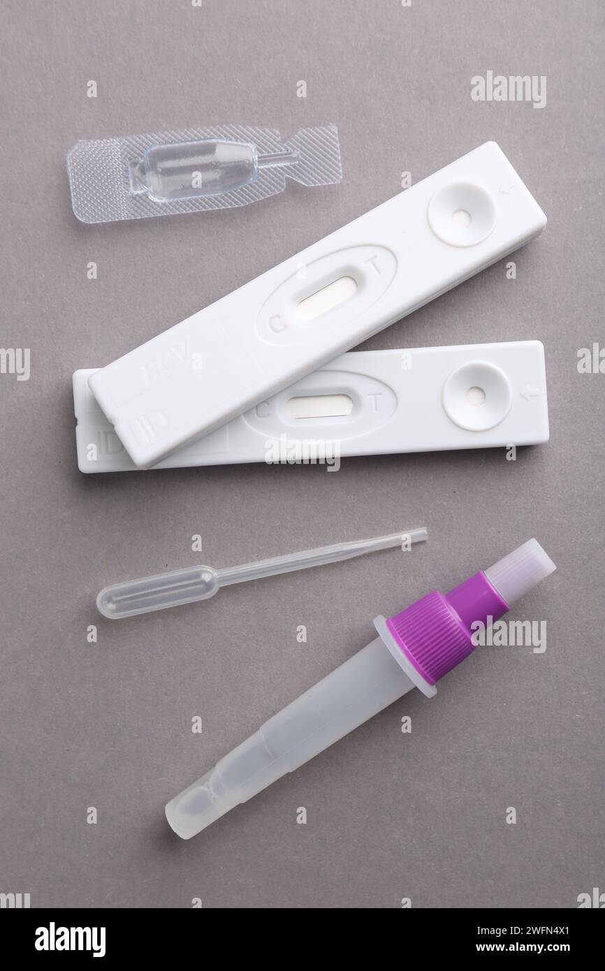 Disposable express test kits on grey background, flat lay Stock Photo ...