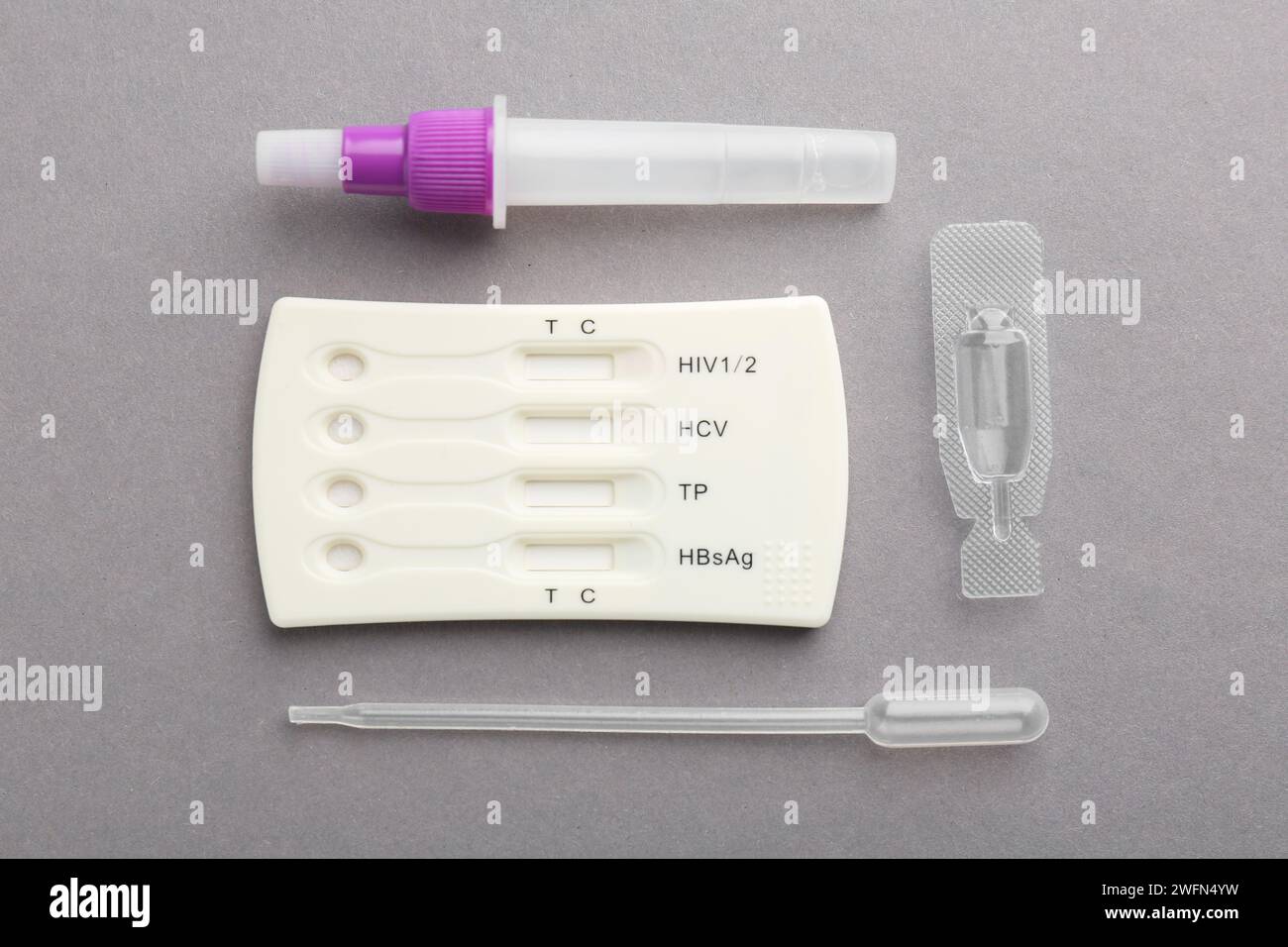 Disposable multi-infection express test kit on grey background, flat ...