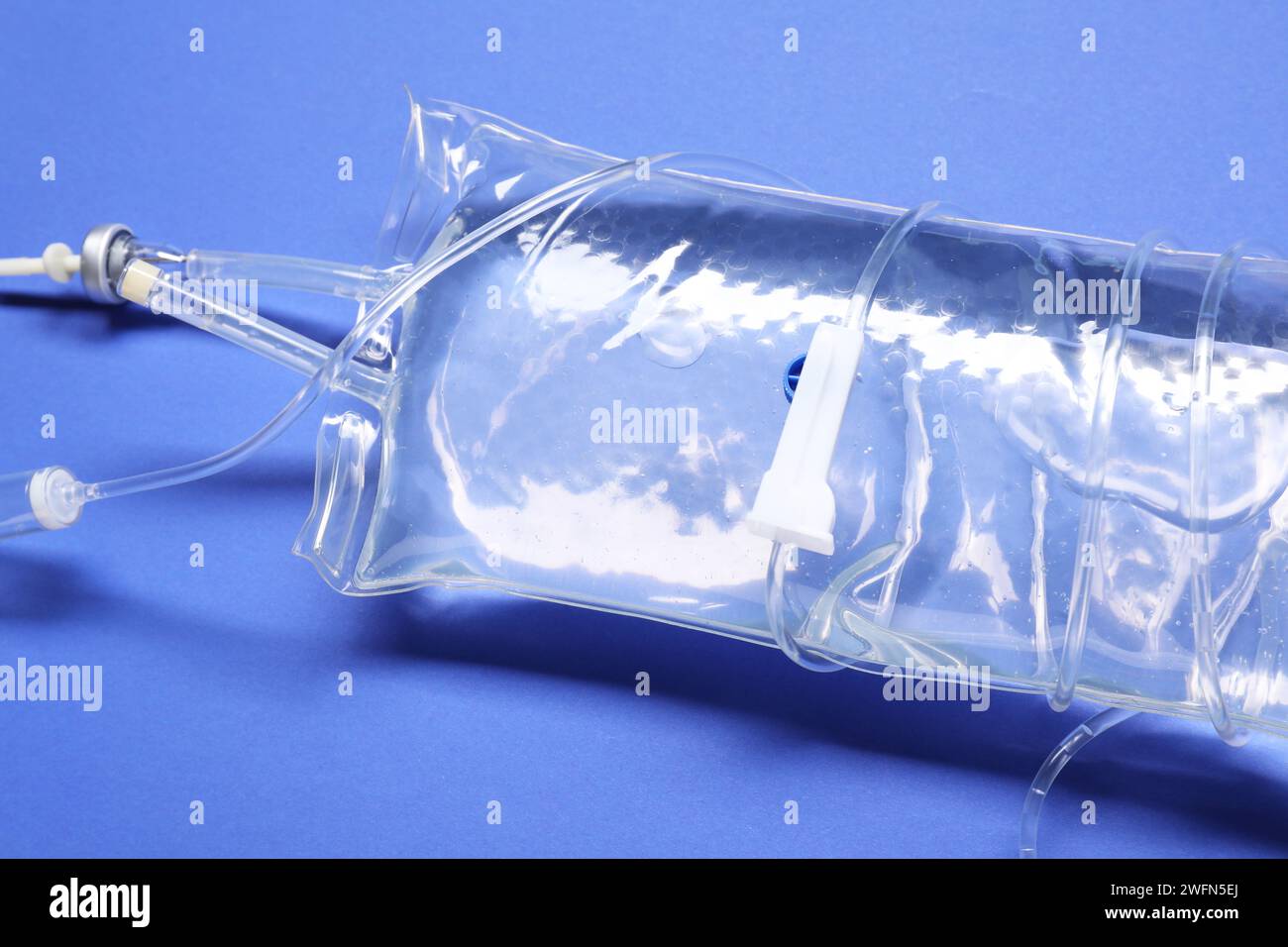 IV infusion set on blue background, closeup Stock Photo - Alamy