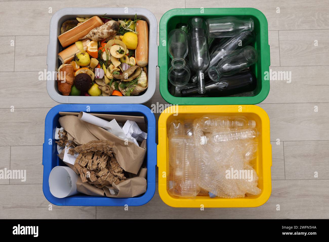 Garbage sorting. Full trash bins for separate waste collection indoors ...