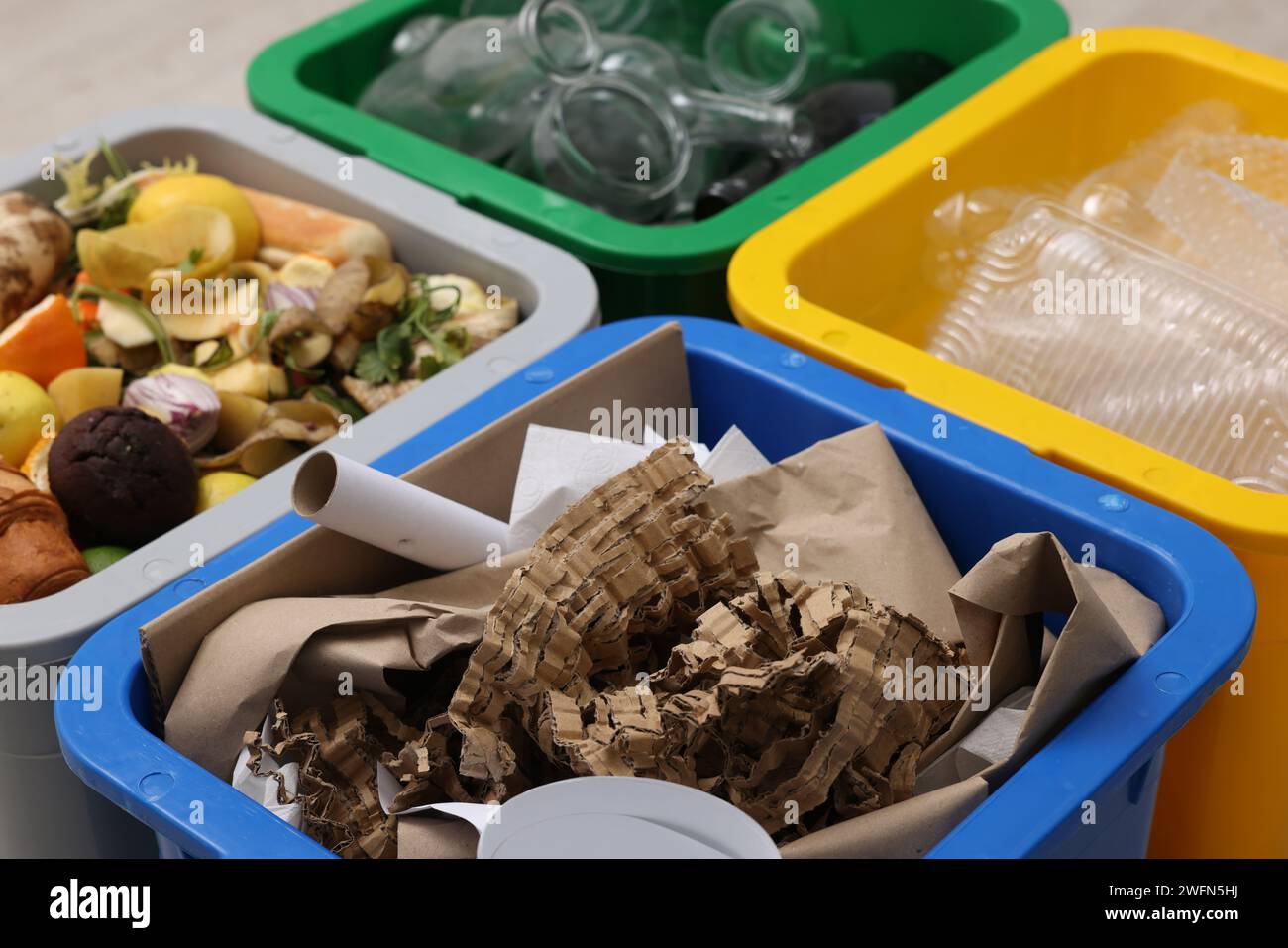 Garbage sorting. Full trash bins for separate waste collection indoors ...