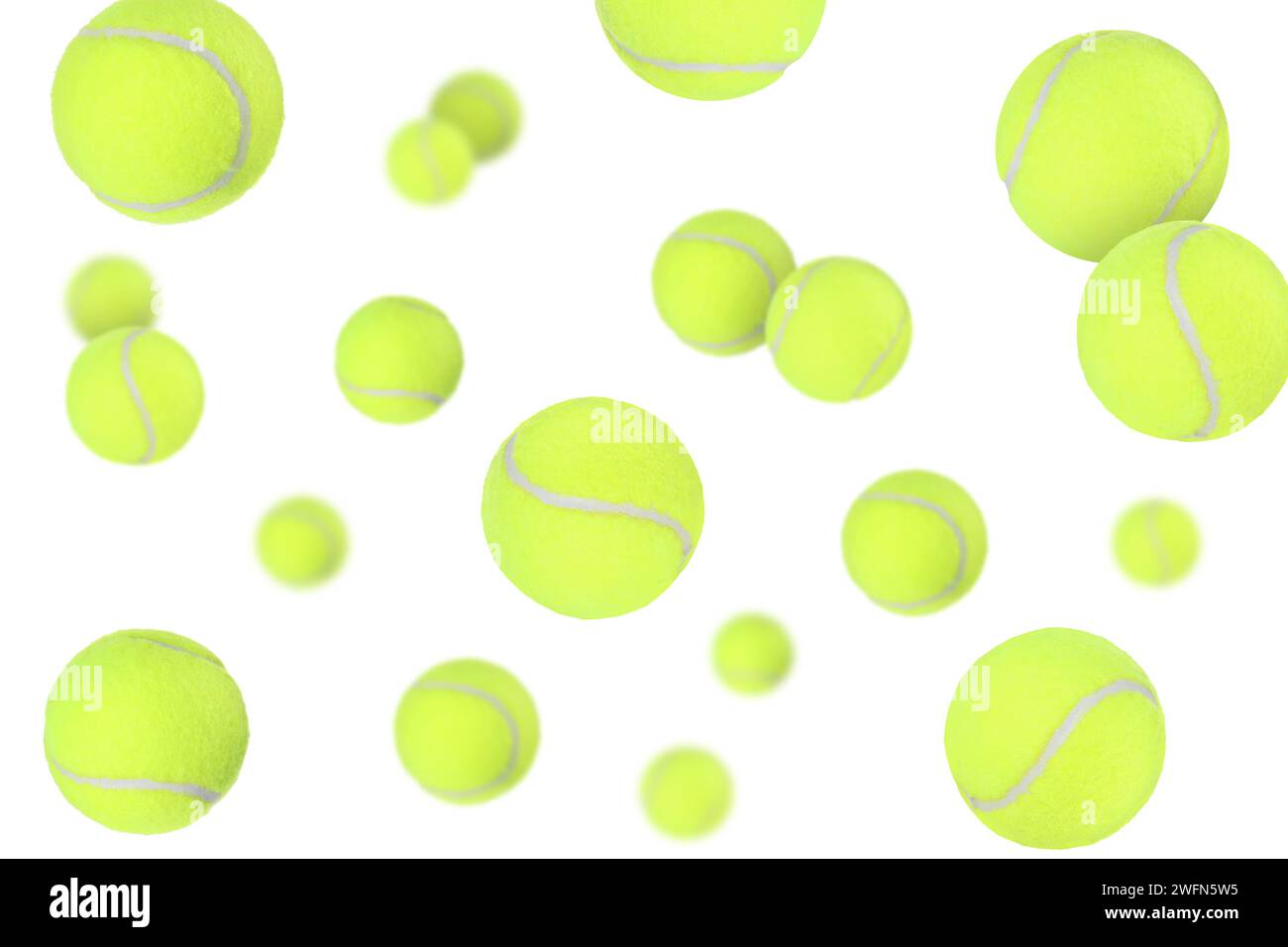 Many tennis balls falling on white background Stock Photo - Alamy