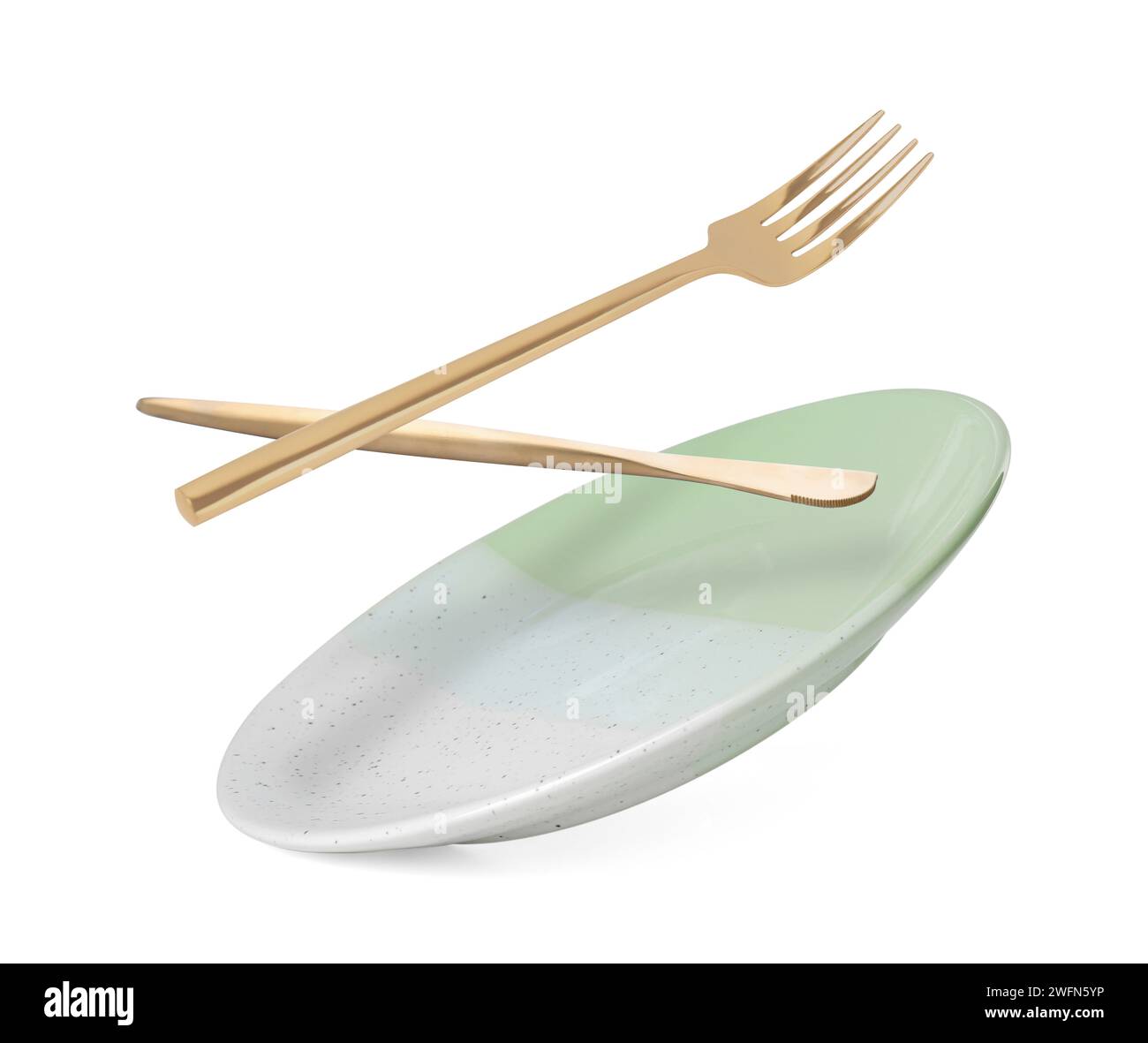 Clean plate, fork and knife falling on white background Stock Photo - Alamy