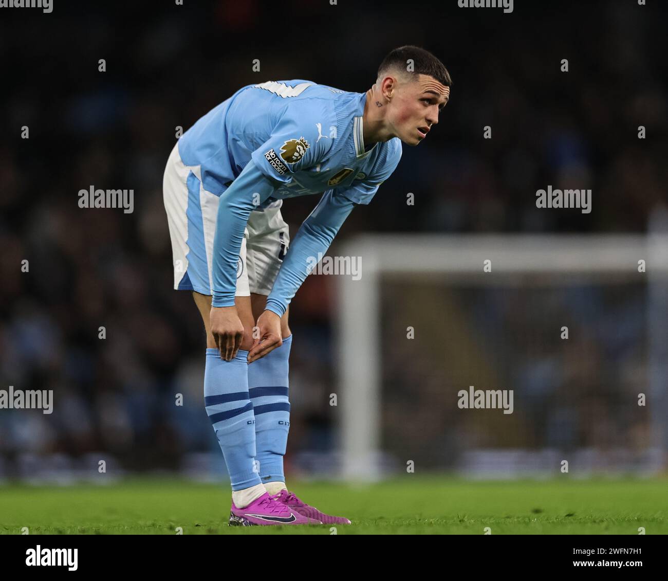 Phil Foden of Manchester City pulls his socks up during the Premier ...