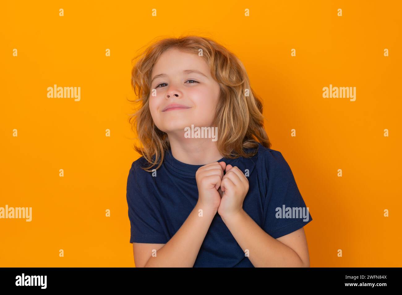 Cute kid dream on yellow isolated studio background. Child daydreaming ...