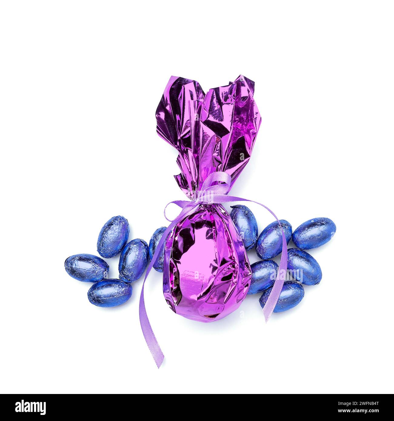 Chocolate Easter eggs wrapped in foil on white background Stock Photo ...