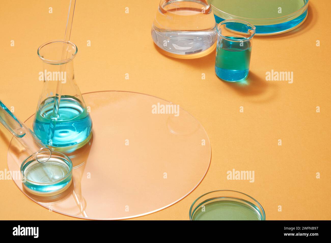 Blue liquid contained inside laboratory glassware with empty area for ...