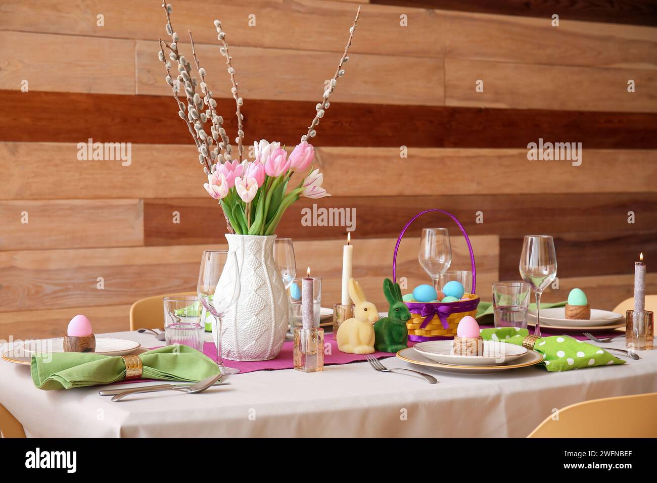 Beautiful Easter table setting with flowers and eggs in dining room ...