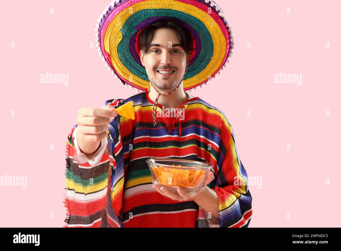 Mexican man poncho sombrero eating hi-res stock photography and images ...
