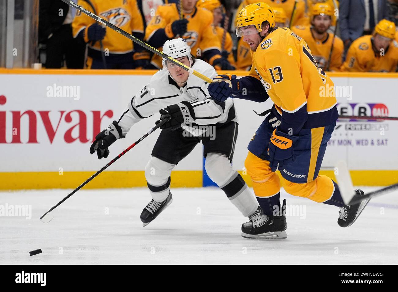 Nashville Predators center Yakov Trenin (13) and Los Angeles Kings ...