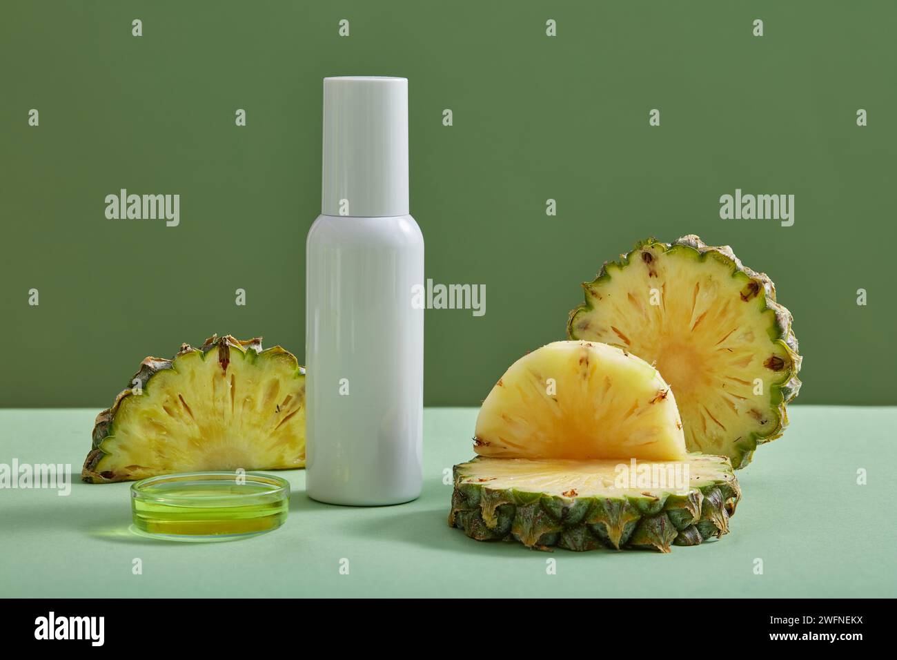 Pineapple essence contained in a petri dish with empty label bottle and ...