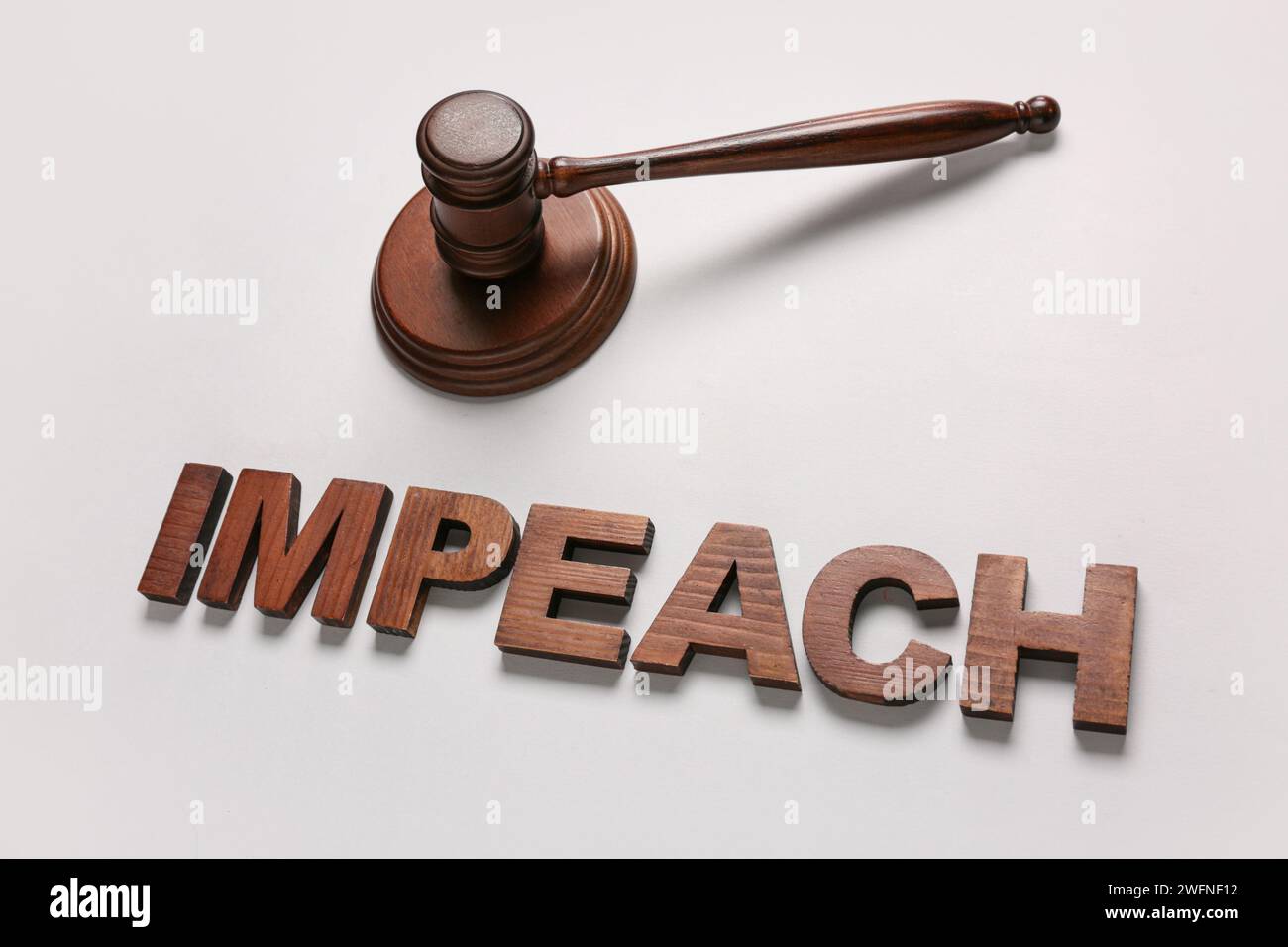 Judge gavel and word IMPEACH on white background Stock Photo - Alamy
