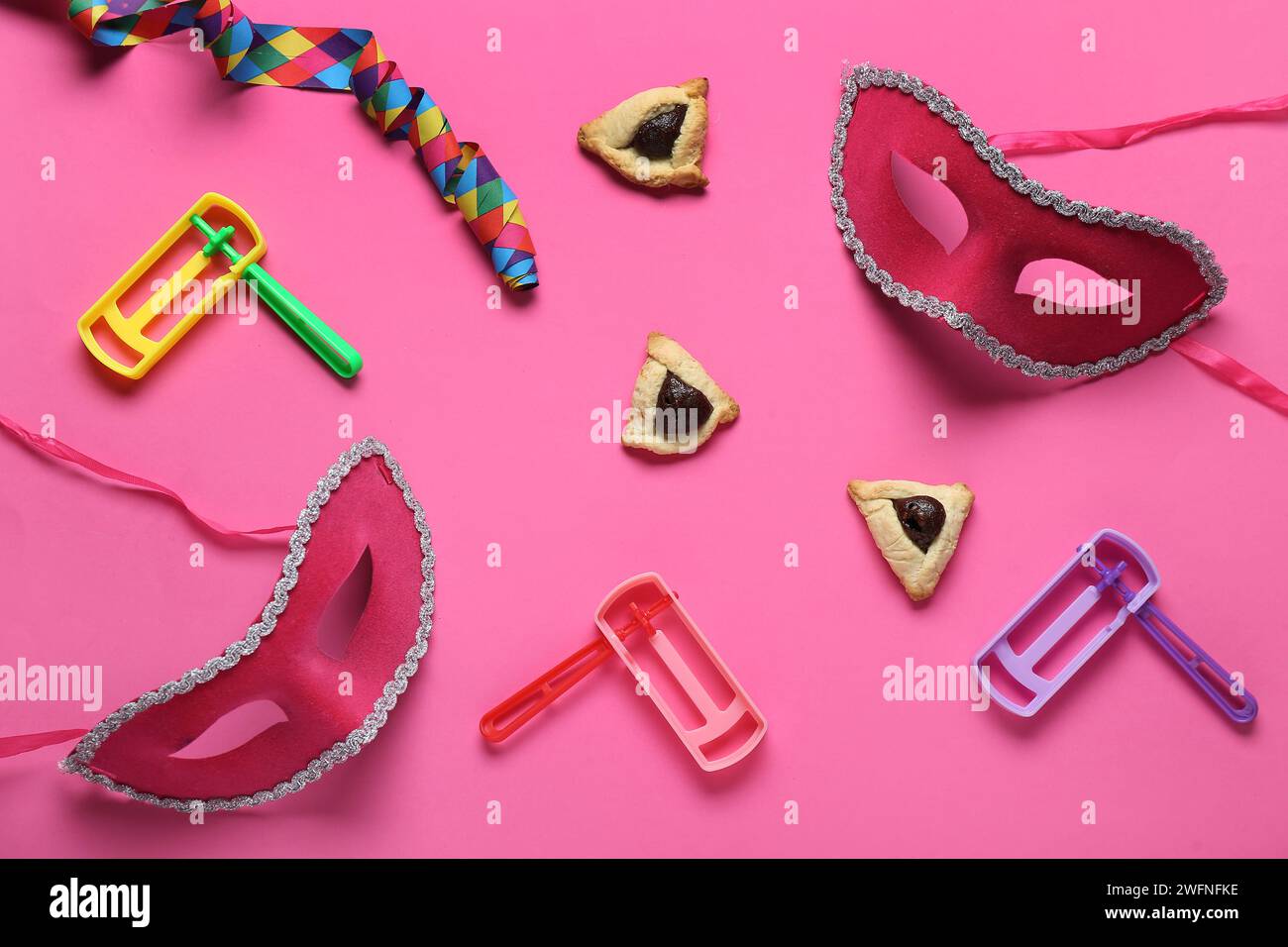 Carnival masks with hamantaschen cookies and rattles for Purim holiday ...