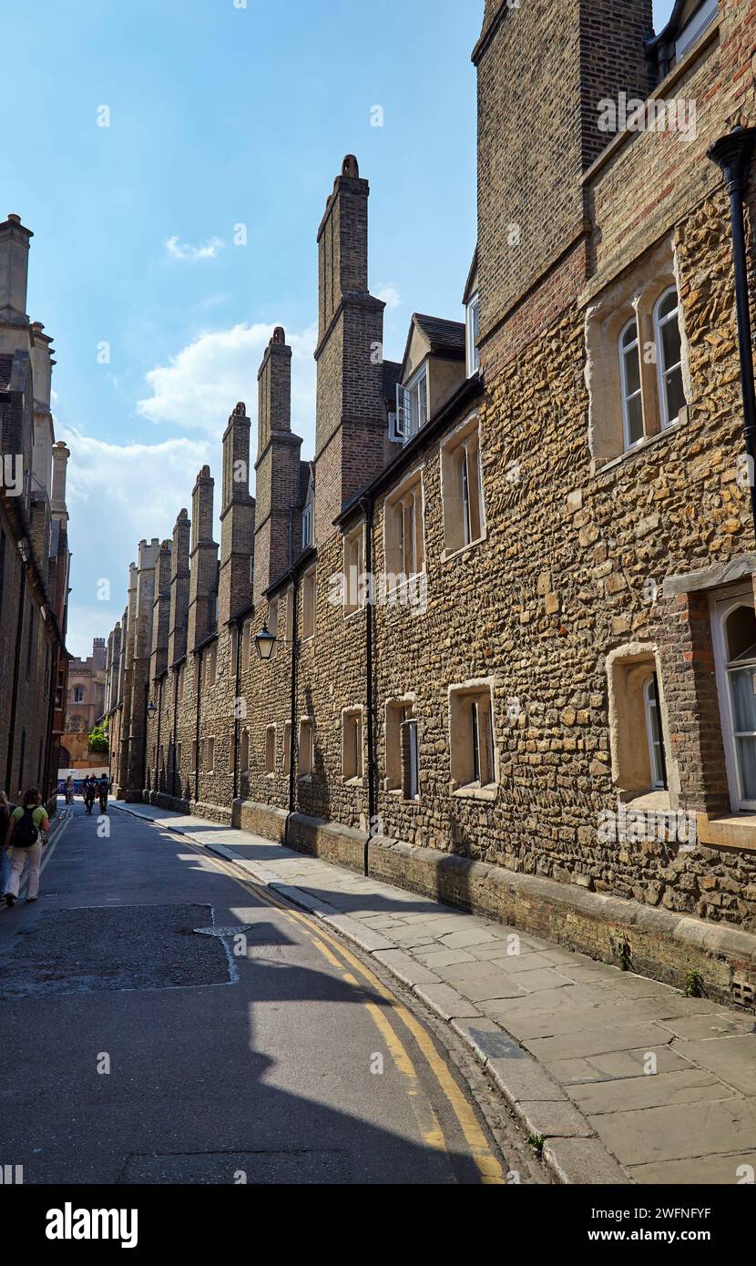 The narrow Trinity line street passes along the brick wall of Trinity ...