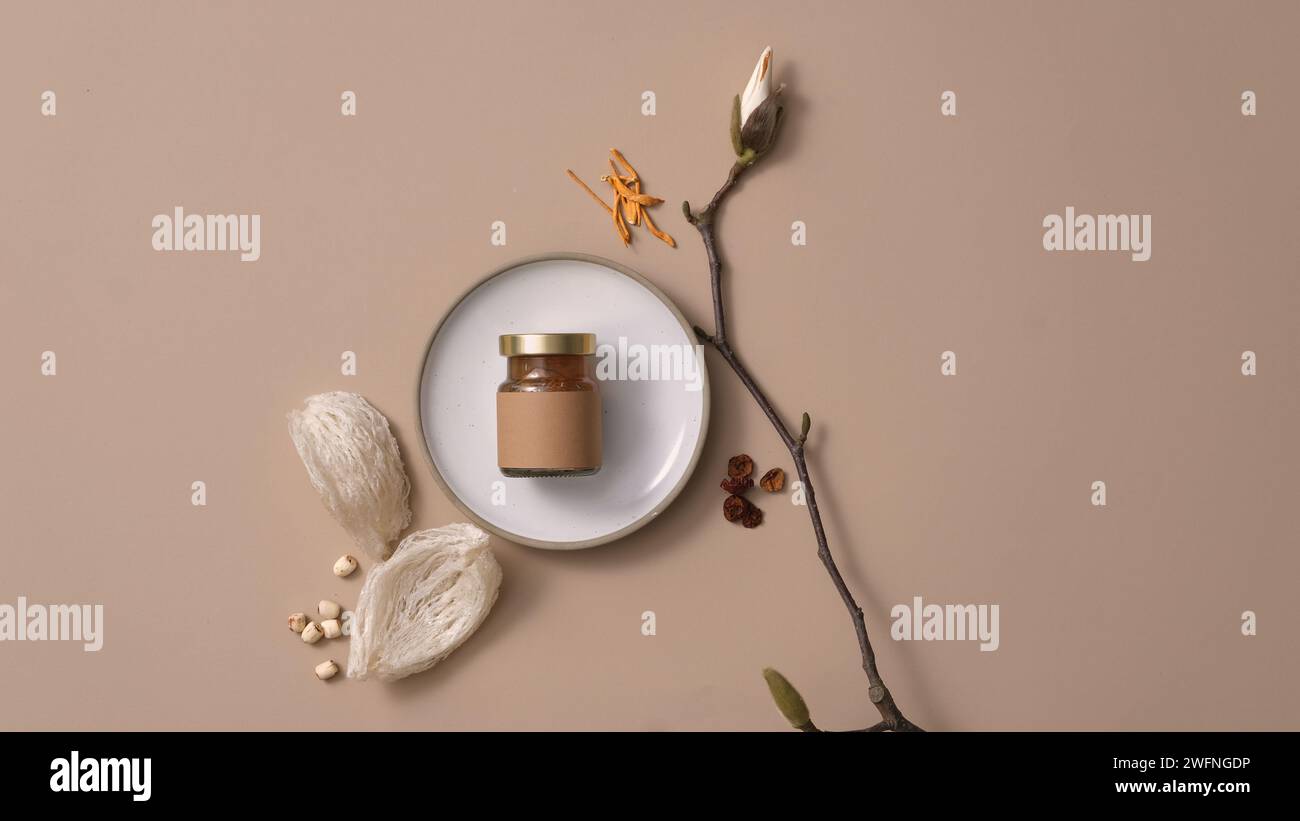 An empty label jar placed on white dish, edible bird’s nest, lotus ...
