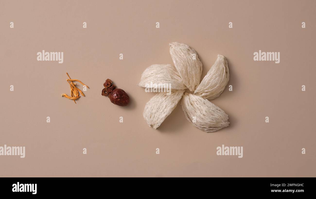 Top view of cordyceps, jujube decorated with edible bird’s nest on ...