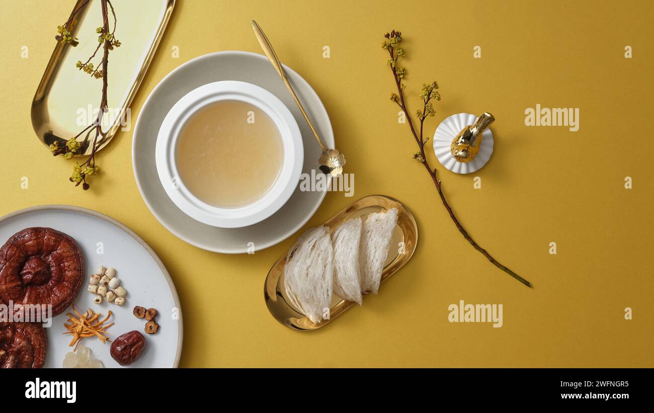 A white bowl containing bird’s nest soup arranged with edible bird’s ...