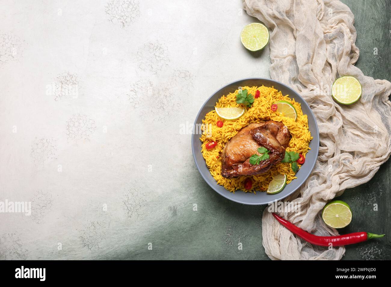 Bowl of traditional chicken biryani with ingredients on table Stock ...