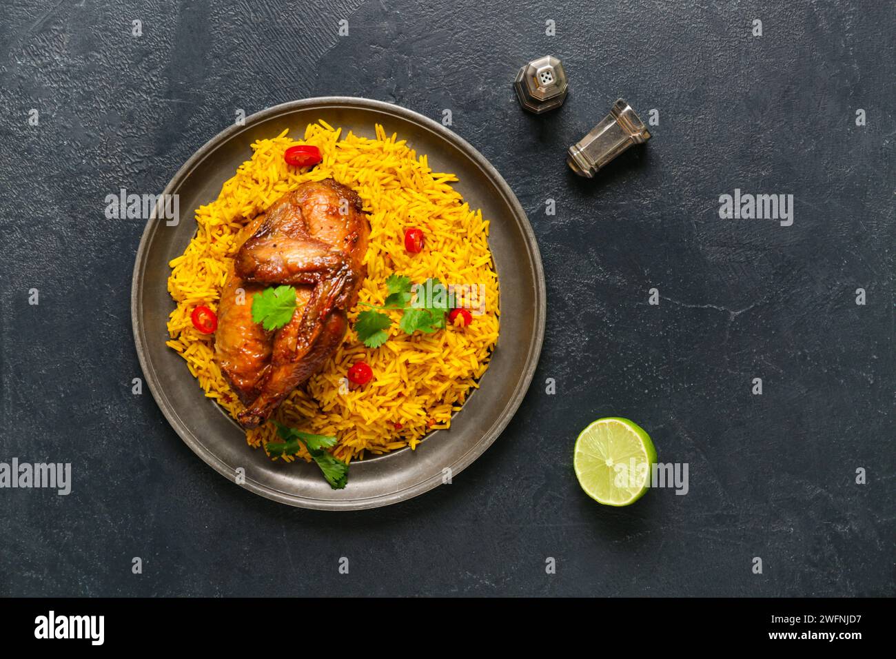 Plate of traditional chicken biryani on black background Stock Photo ...