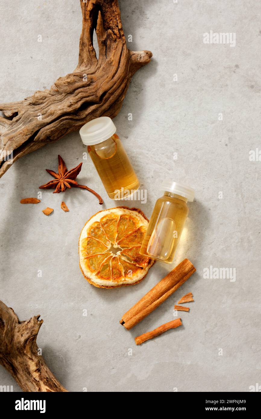 A tree branch decorated with empty bottle jars filled with essential ...