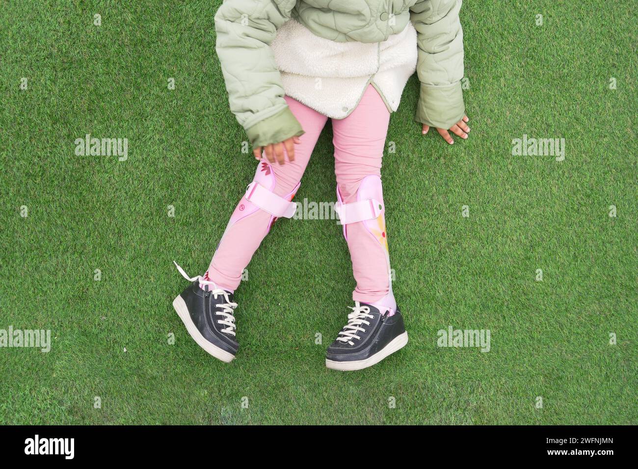 Child cerebral palsy disability, legs orthosis Stock Photo - Alamy