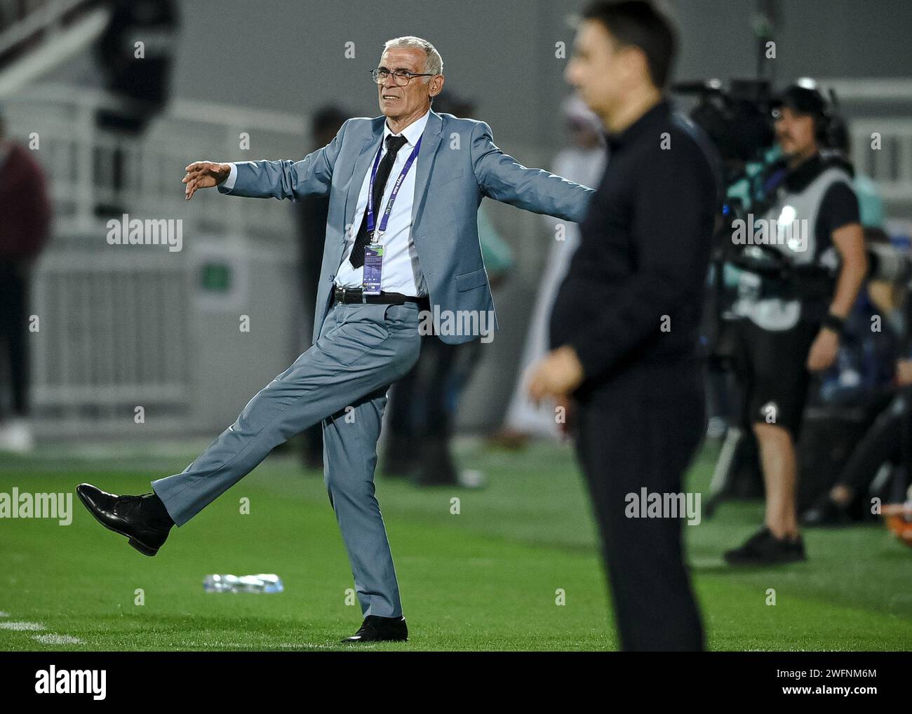 Doha, Qatar. 31st Jan, 2024. Hector Cuper (L), head coach of Syria ...
