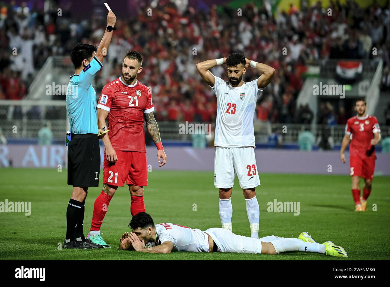 Doha, Qatar. 31st Jan, 2024. Mehdi Taremi of Iran lies on the ground as ...