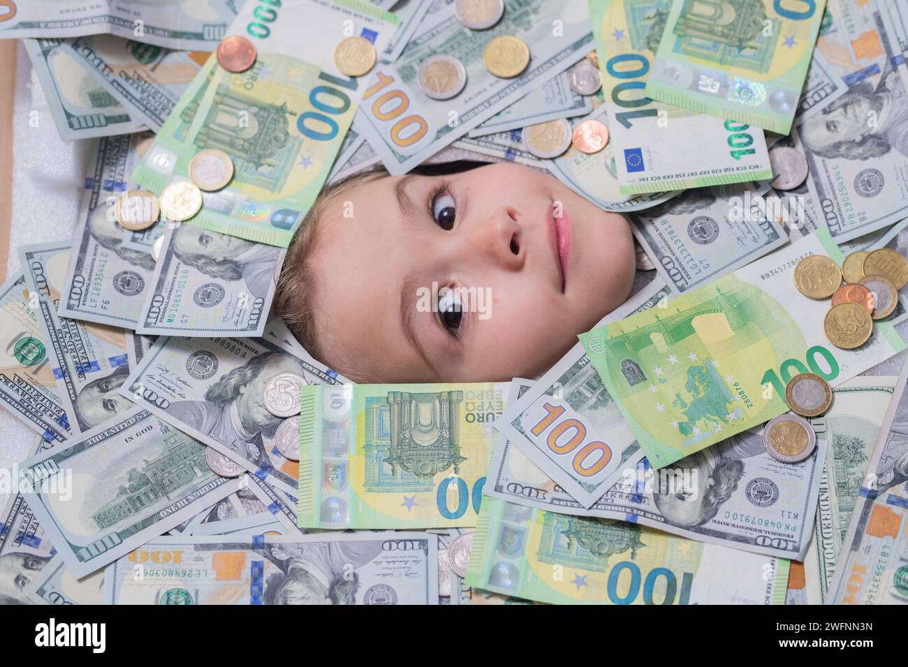 Euro and dollar concept. Money win, big luck. Kid with fun face in ...