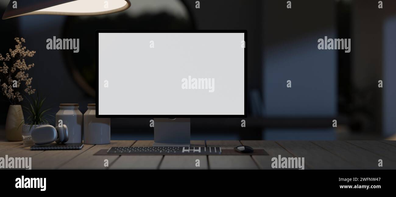 A white-screen computer mockup and decor on a wooden plank table in a ...