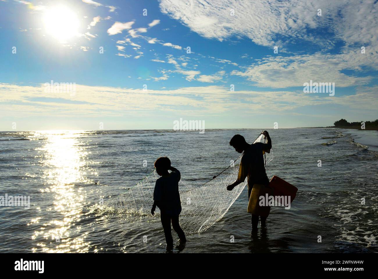 Fishing by the beach in Sittwe, Bay of Bengal, Myanmar Stock Photo - Alamy