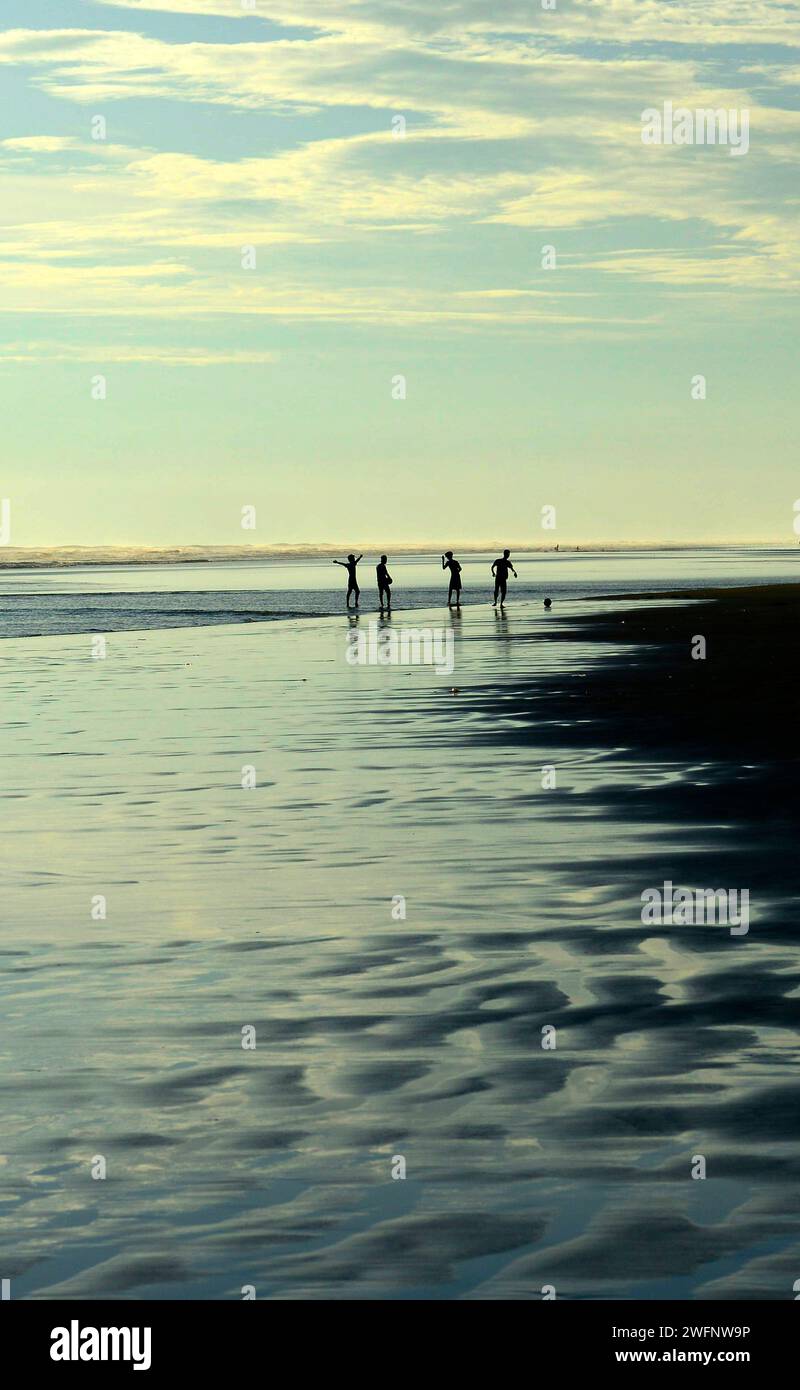 Arakanese men playing football on beach in Sittwe, Rakhine State ...