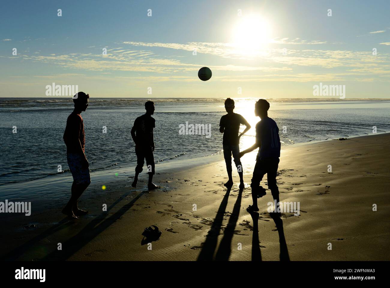 Arakanese men playing football on beach in Sittwe, Rakhine State ...