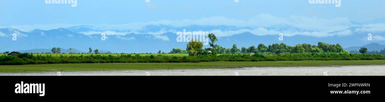Misty mountains after a rainy morning seen from the Kaladan river in ...